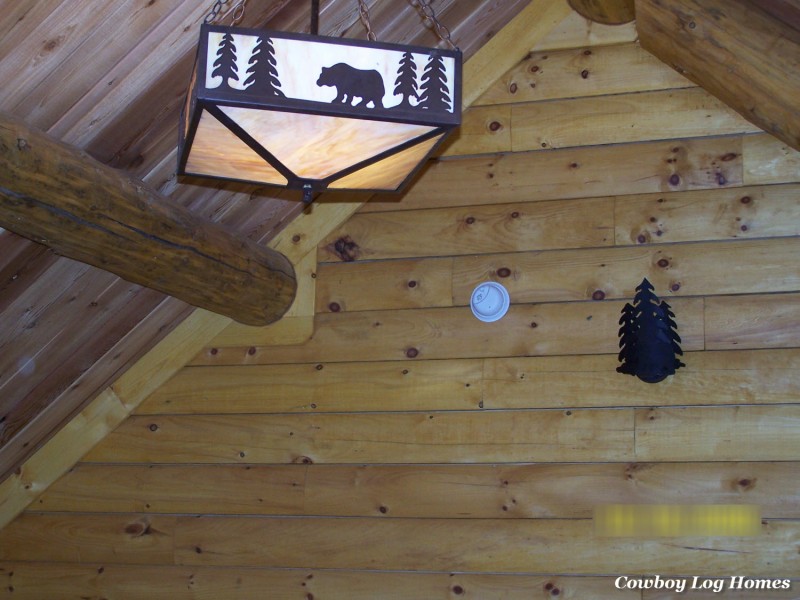 Log Wall Stacked with Solid Log Gable End | Cowboy Log Homes
