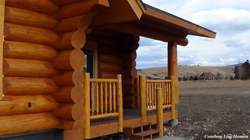 Handcrafted Log Railing on Covered Porch | Cowboy Log Homes