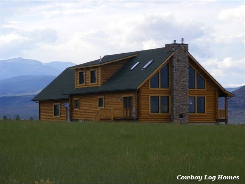Log Home with Shed Dormer and Stone Fireplace | Cowboy Log Homes