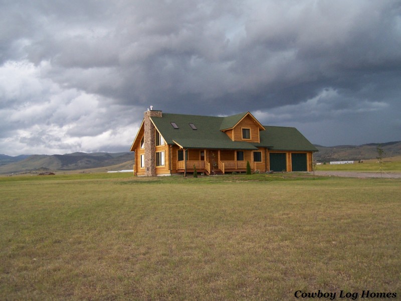 Log Home with Storm Brewing | Cowboy Log Homes