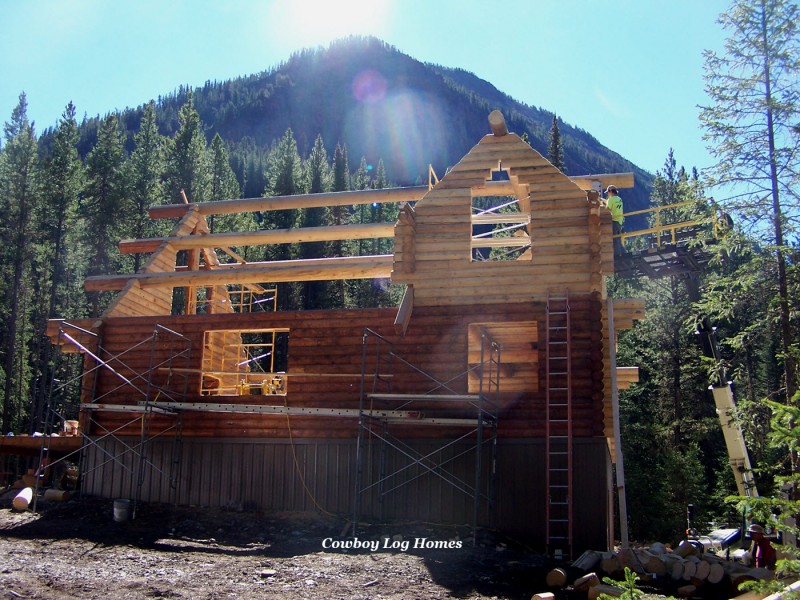 Log Home with Stacked Log Dormer | Cowboy Log Homes