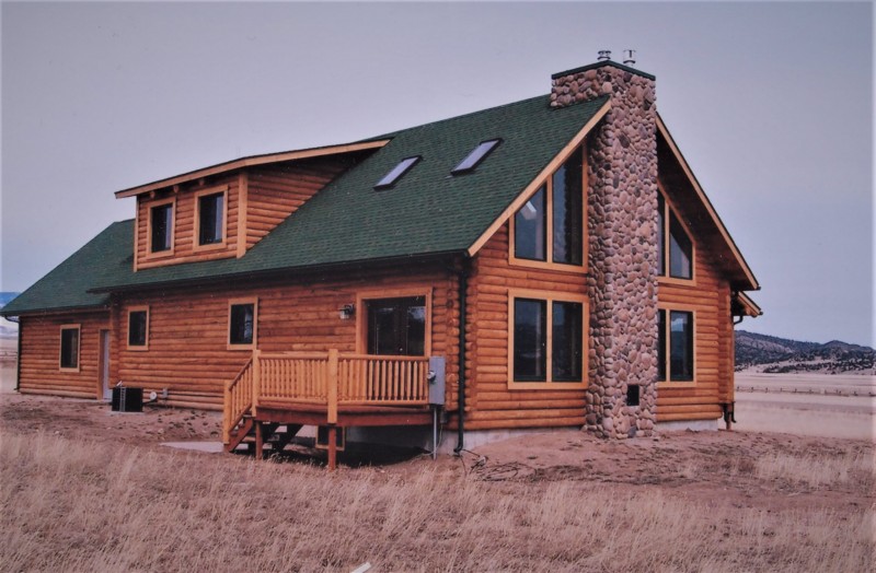 Classic Log Home with Stone Fireplace | Cowboy Log Homes