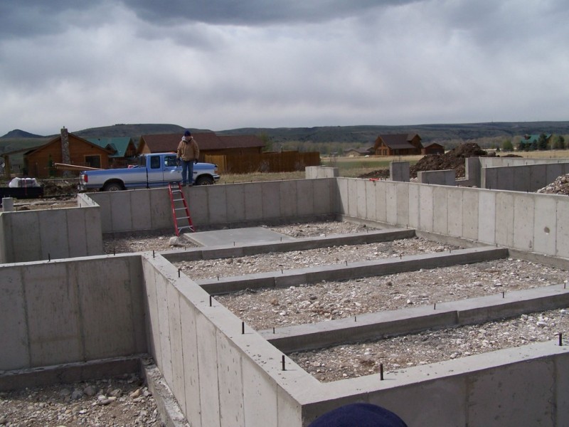 Installing log home foundation | Cowboy Log Homes