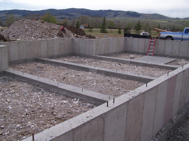 Installing log home foundation | Cowboy Log Homes